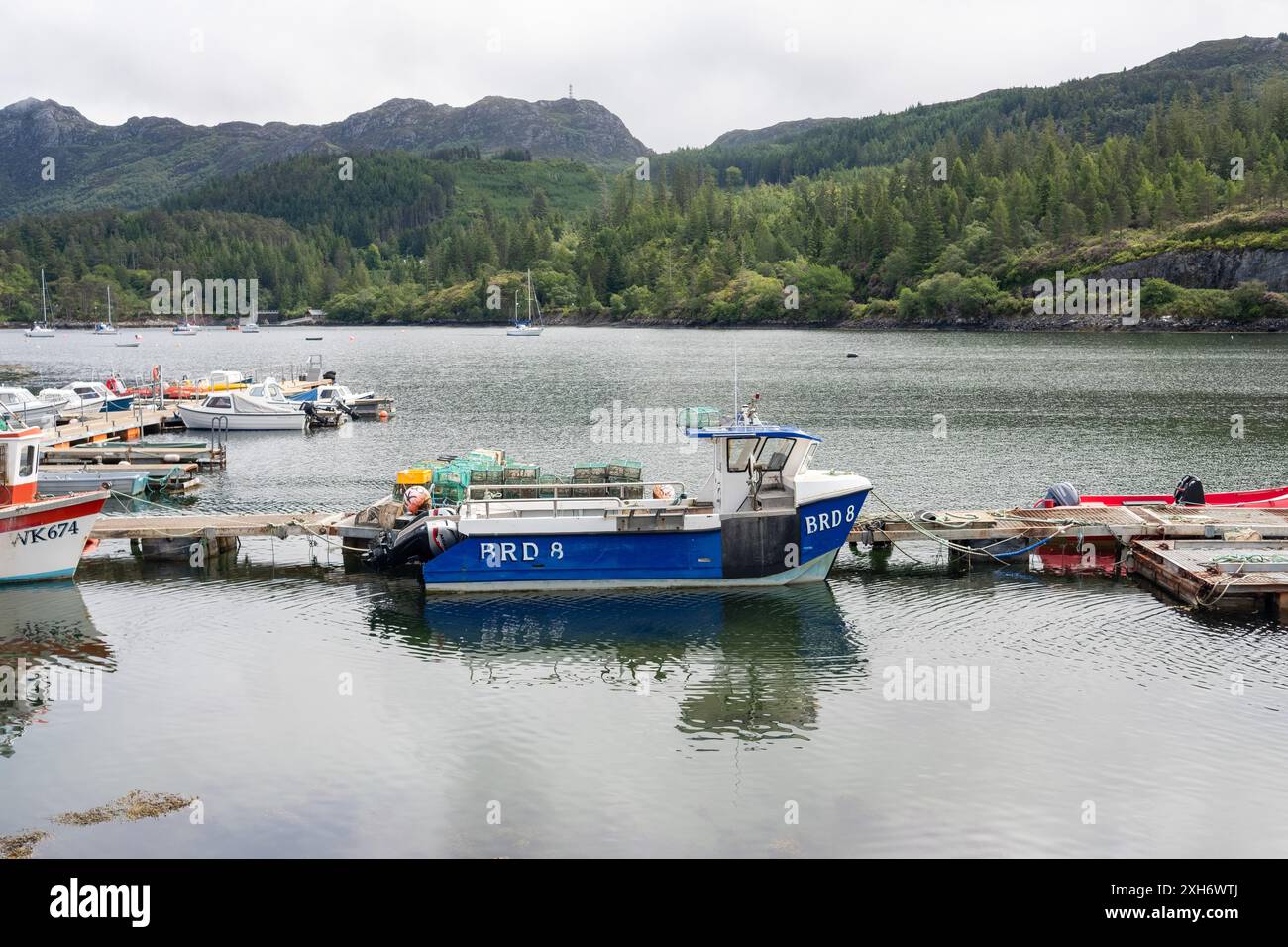 A fishing boat in Plockton Harbour in the Scottish Highlands Stock ...