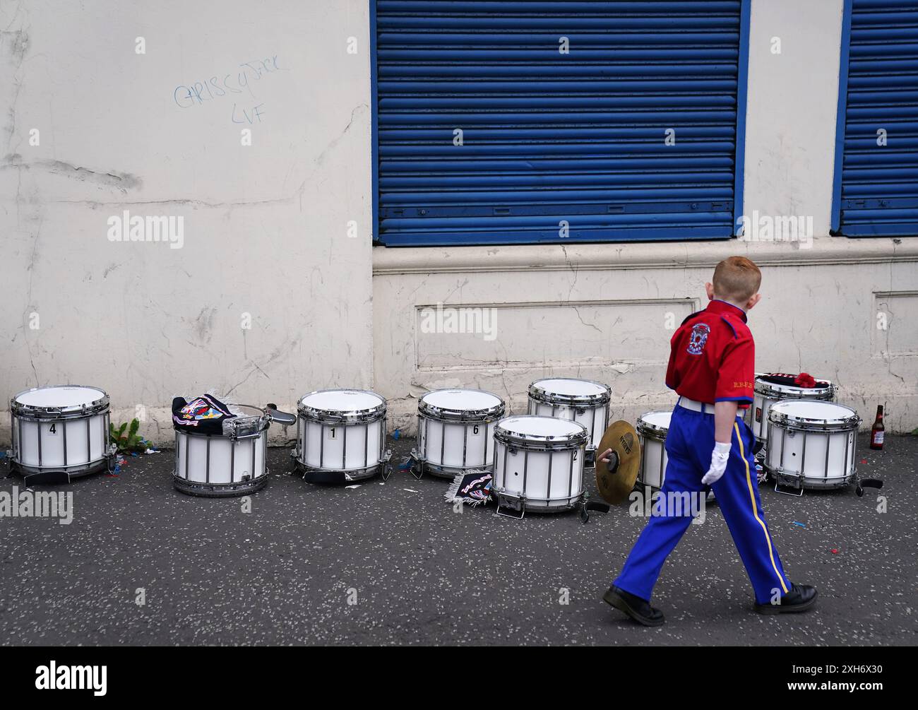 People gather at Carlisle Circus in Belfast ahead of an Orange Order ...