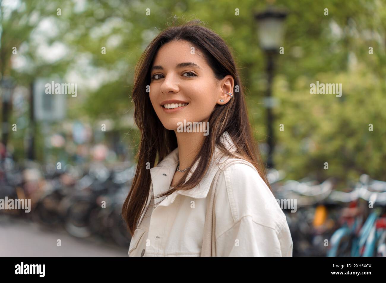 Radiating confidence, a young woman poses against the iconic backdrop ...