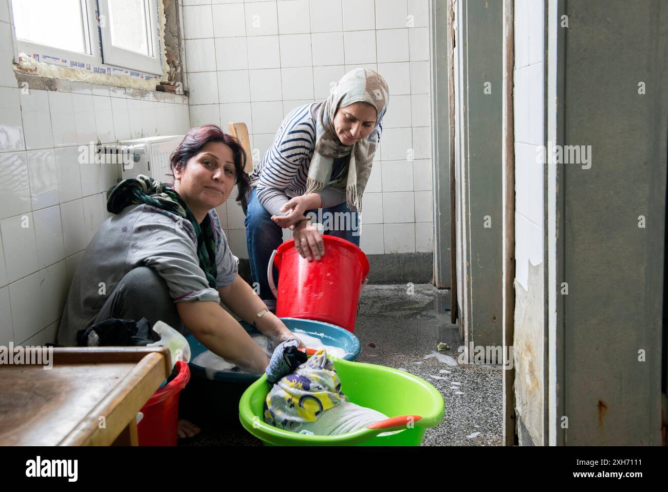 Female Refugees doing Laundry Young adult, female Asylum Seeker ...