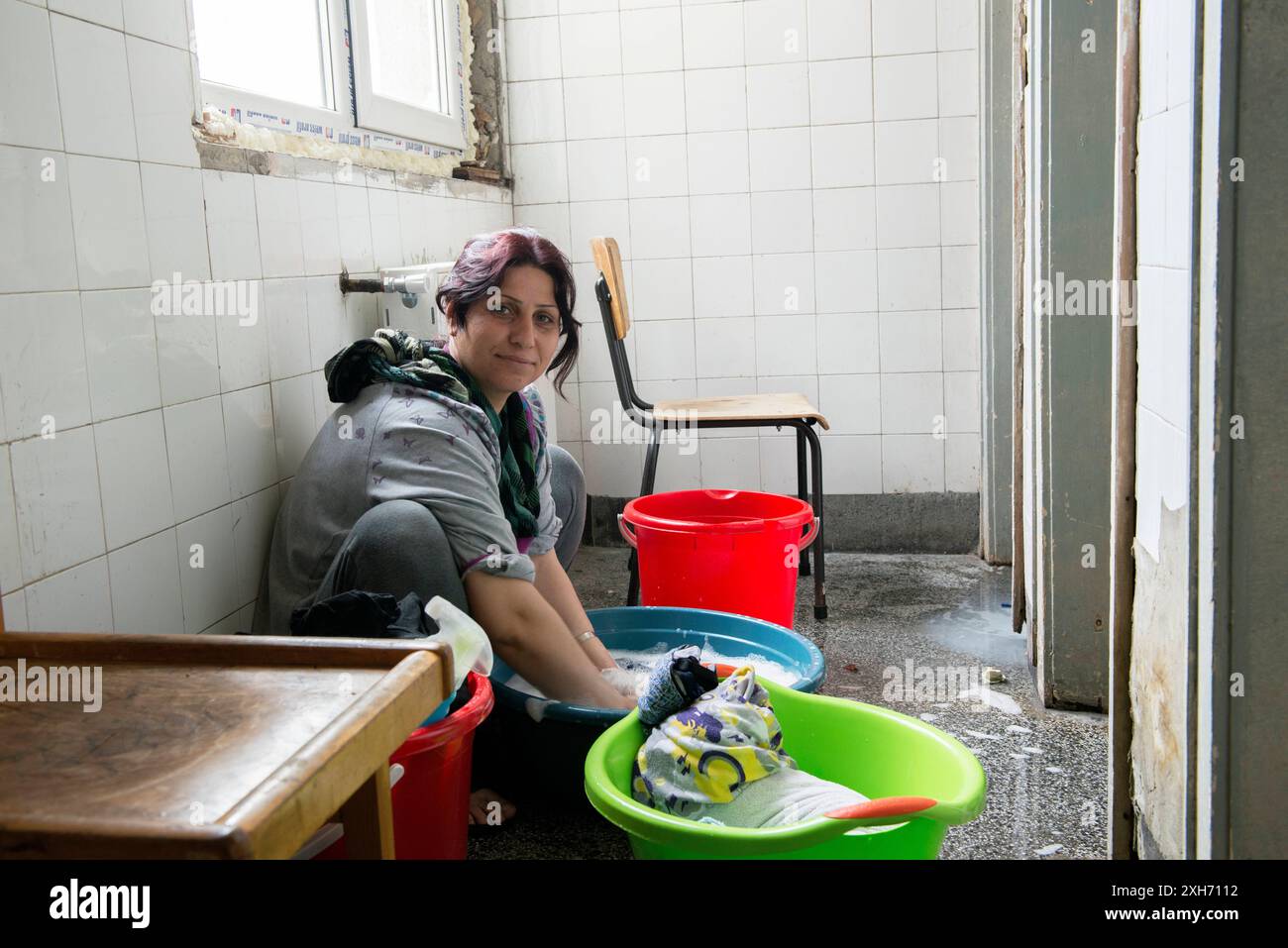 Female Refugees doing Laundry Young adult, female Asylum Seeker ...