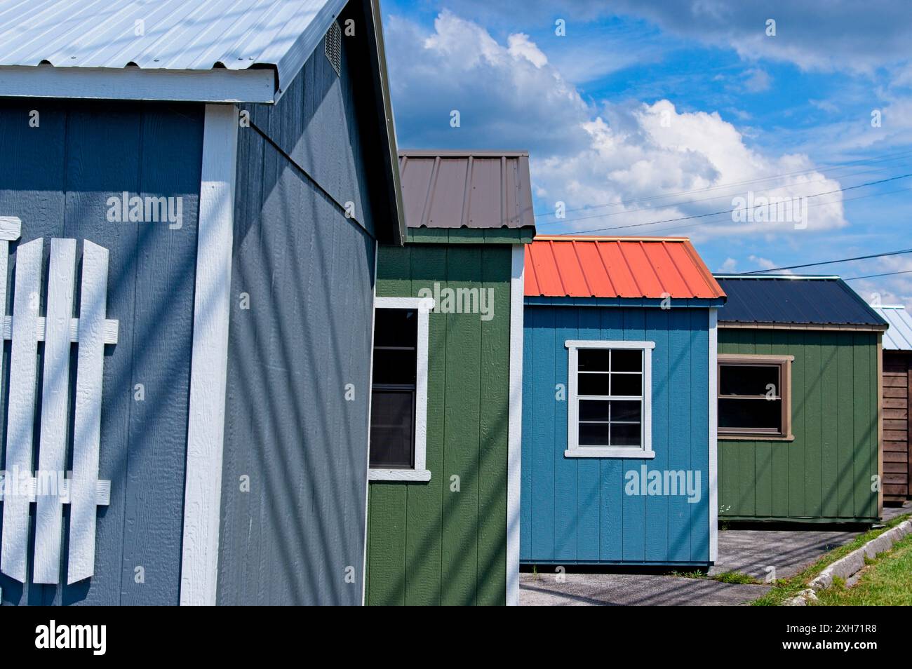 Four storage buildings at an angle with windows and blue sky Stock ...