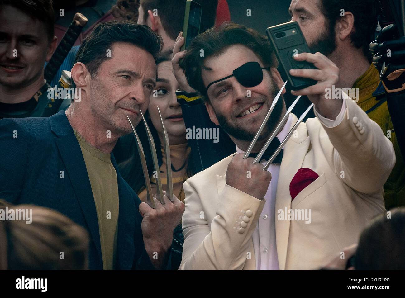 London, UK. 11th July 2024. Hugh Jackman poses for a selfie with a cos ...