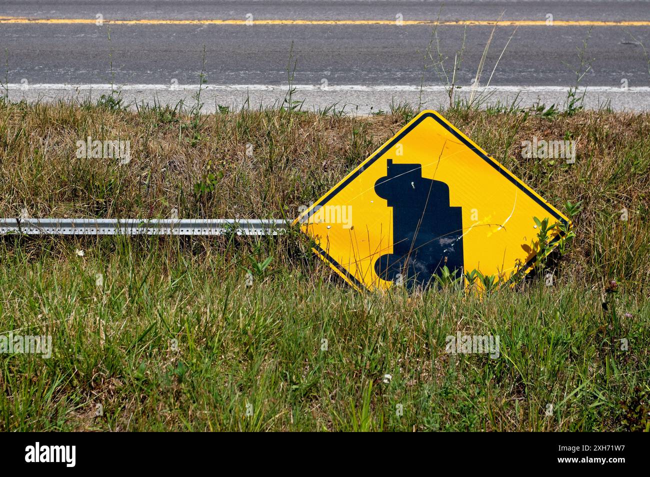 Trucks Entering Highway sign that has fallen by the roadside Stock ...