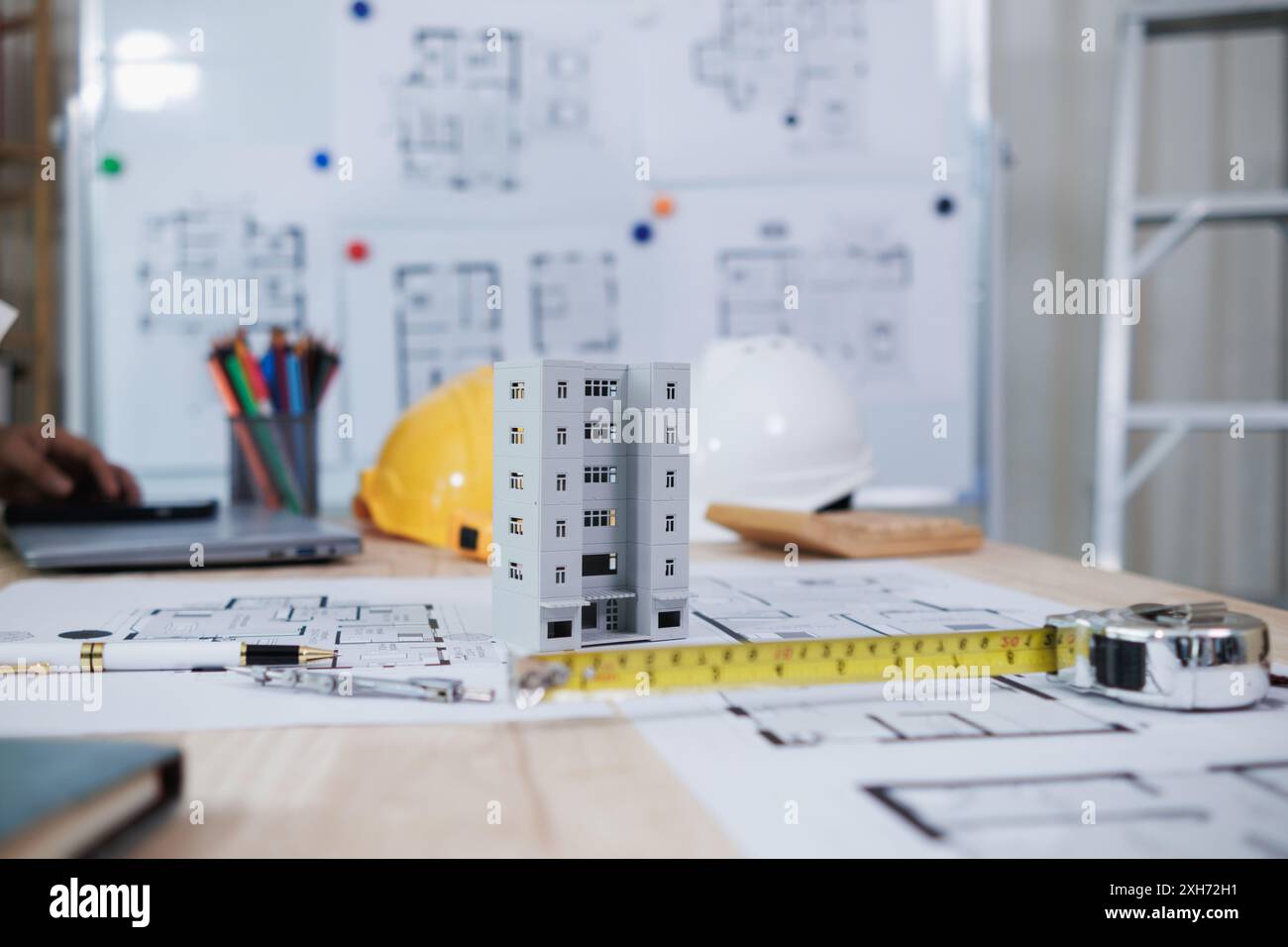 A team of engineers and architects discuss house plan design and ...