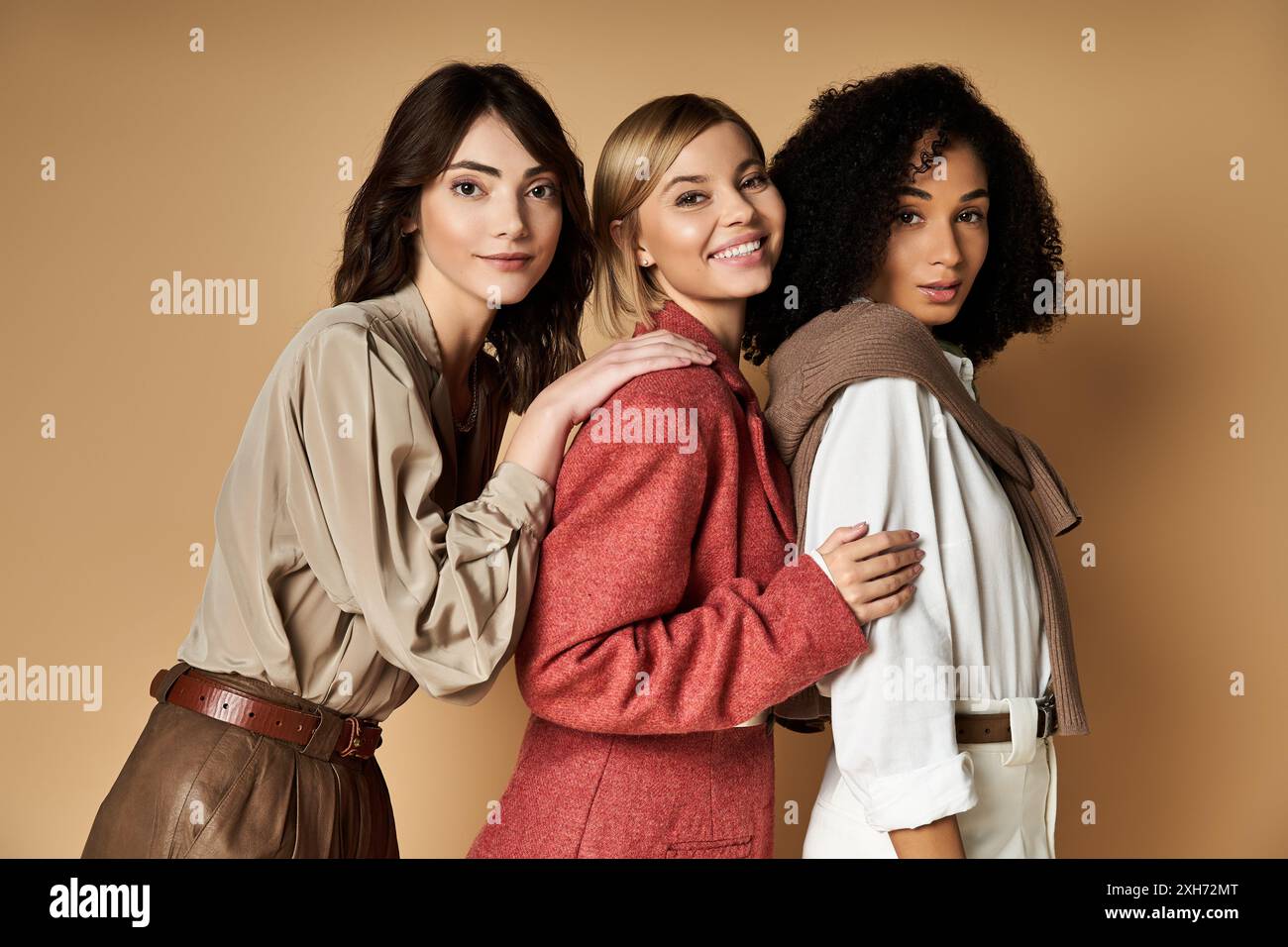 A group of young, beautiful, multicultural women in stylish attire ...