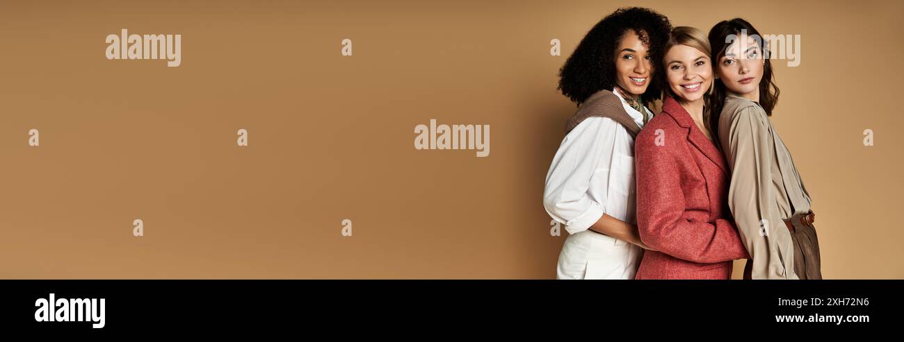 Three young beautiful multicultural women in stylish attire, standing ...