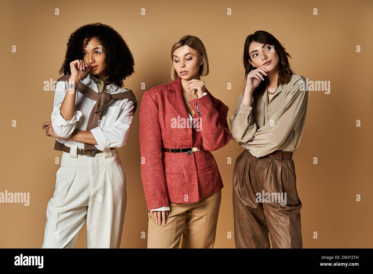 A diverse group of stylish young women of different cultures stand ...