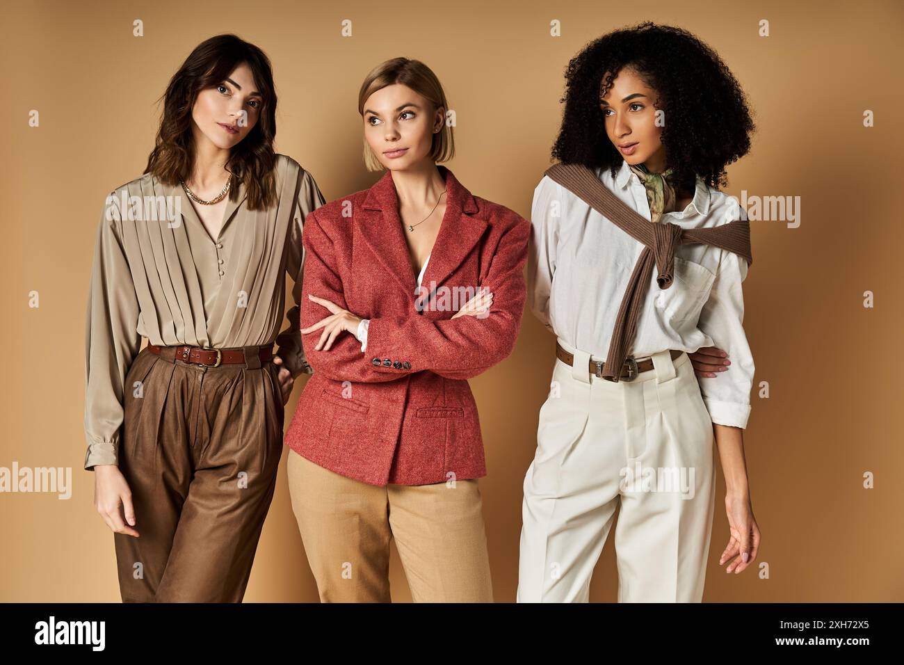 Three young, beautiful women of diverse cultural backgrounds pose ...