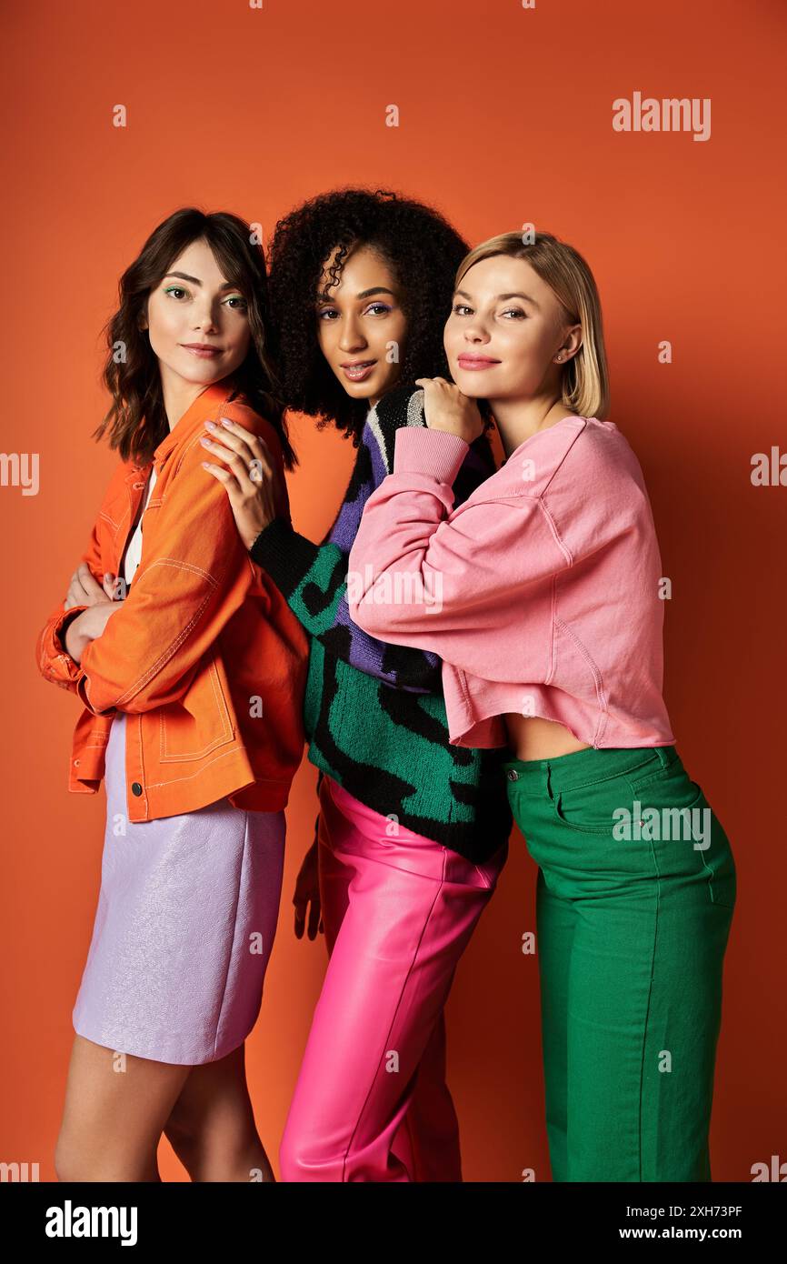 Young, beautiful, multicultural women in stylish attire stand together ...