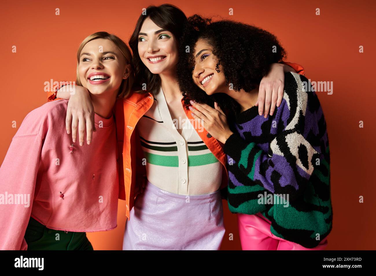 A group of young, beautiful women in vibrant clothes of different ...
