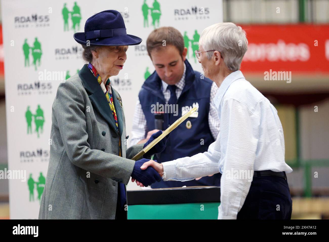 The Princess Royal presents an award during the Riding for the Disabled ...