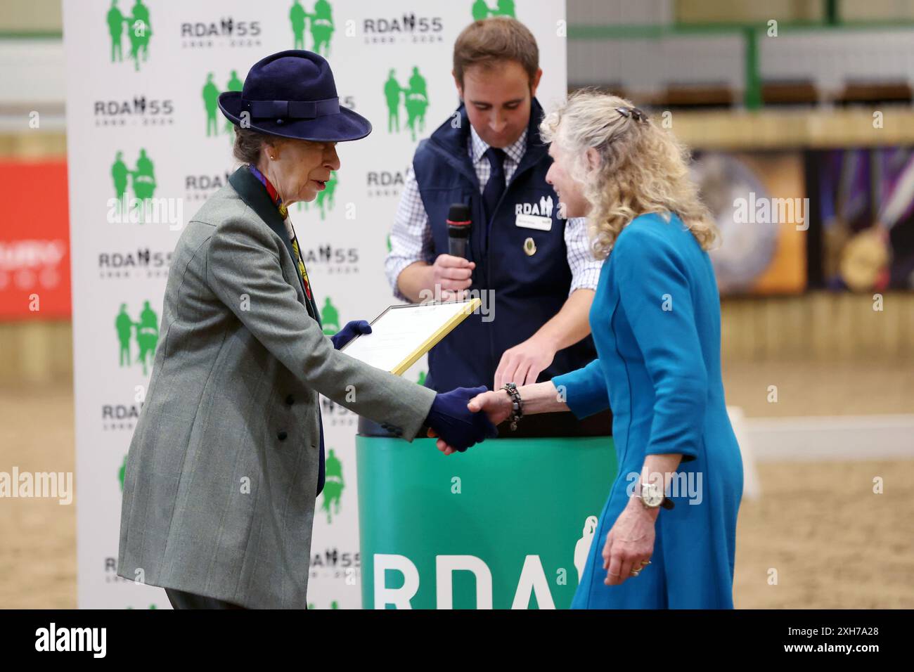 The Princess Royal presents an award during the Riding for the Disabled ...