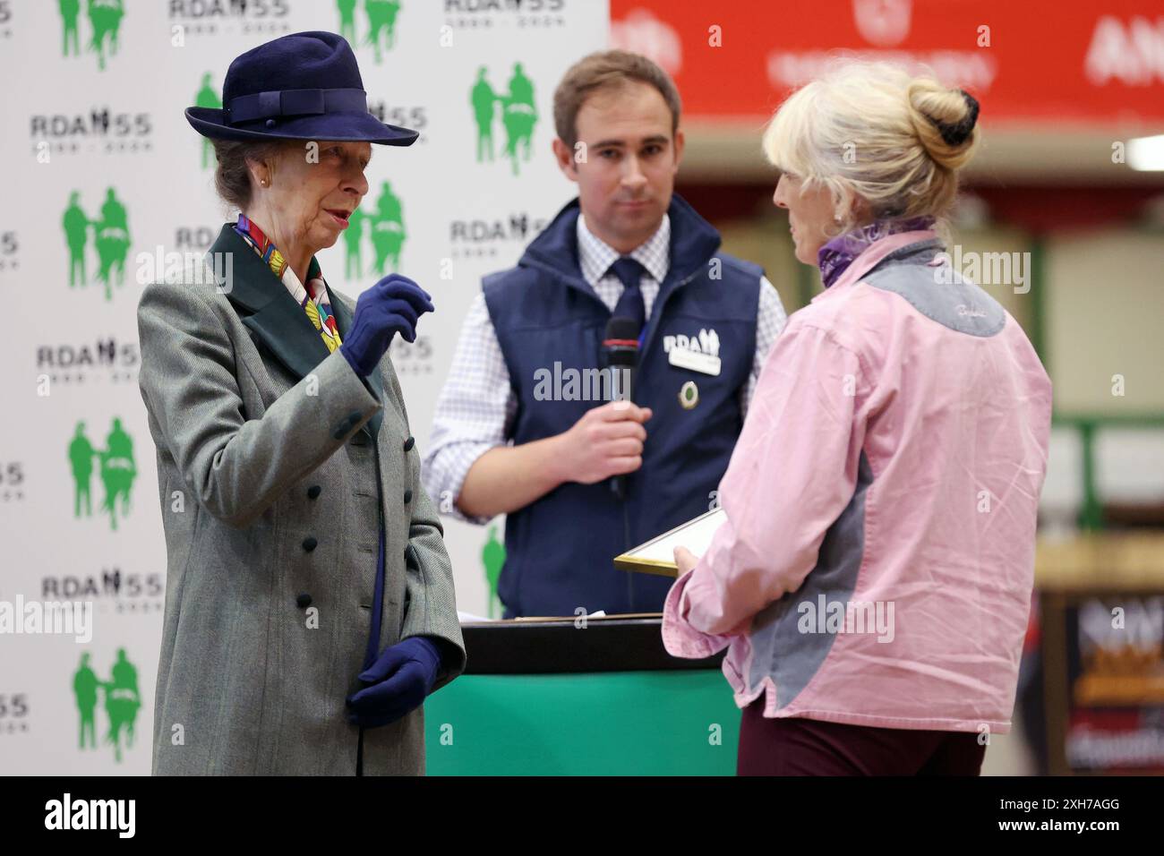 The Princess Royal presents an award during the Riding for the Disabled ...