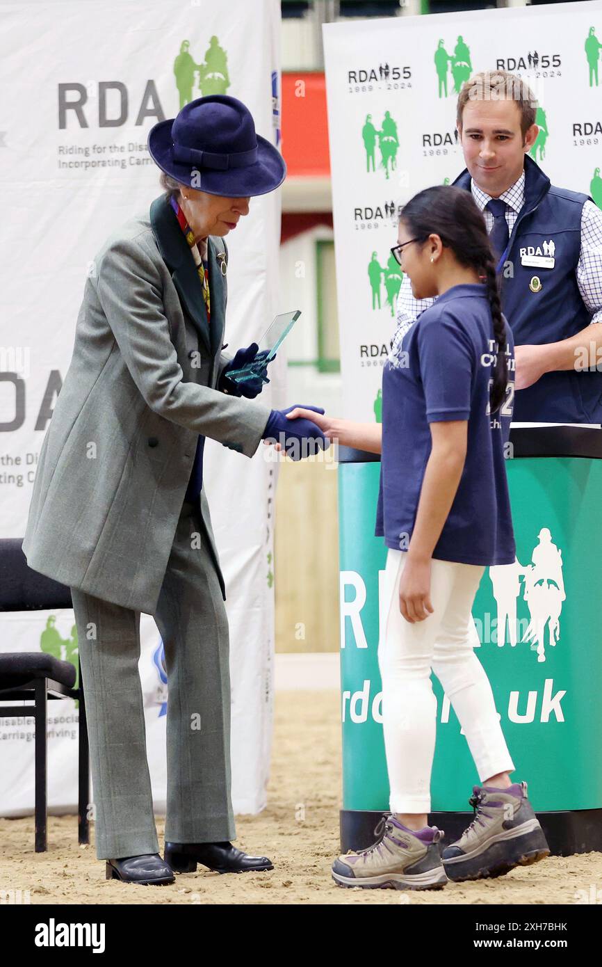The Princess Royal presents an award during the Riding for the Disabled ...