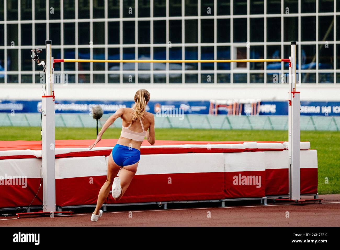 run-up high jump female athlete in athletics competition Stock Photo ...