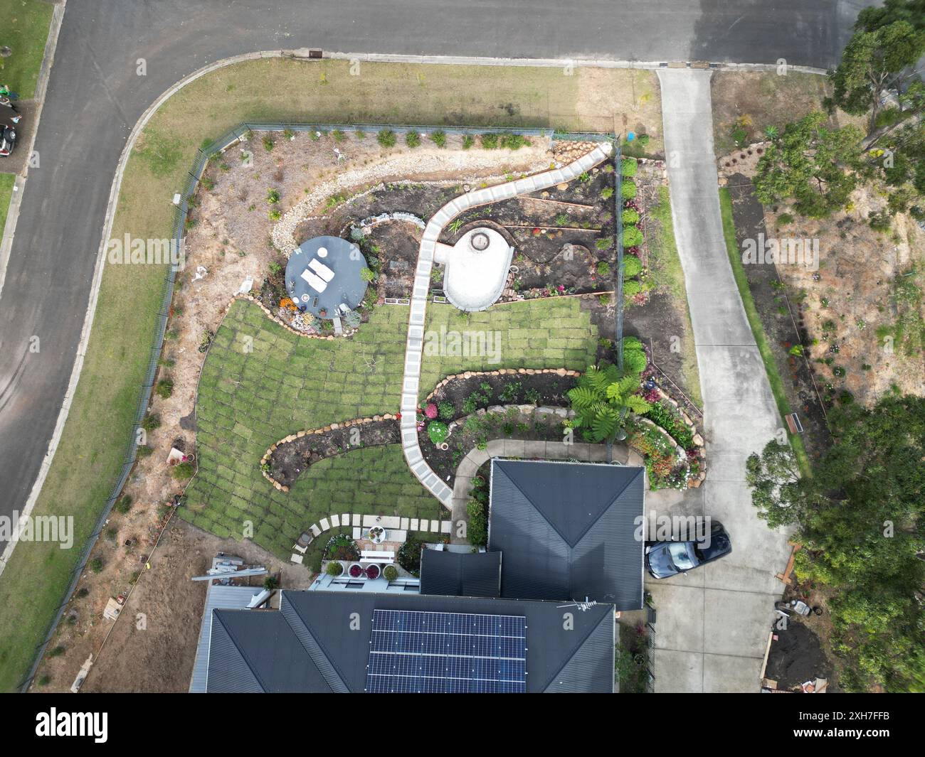 An aerial view of a landscaped backyard with a garden Stock Photo - Alamy
