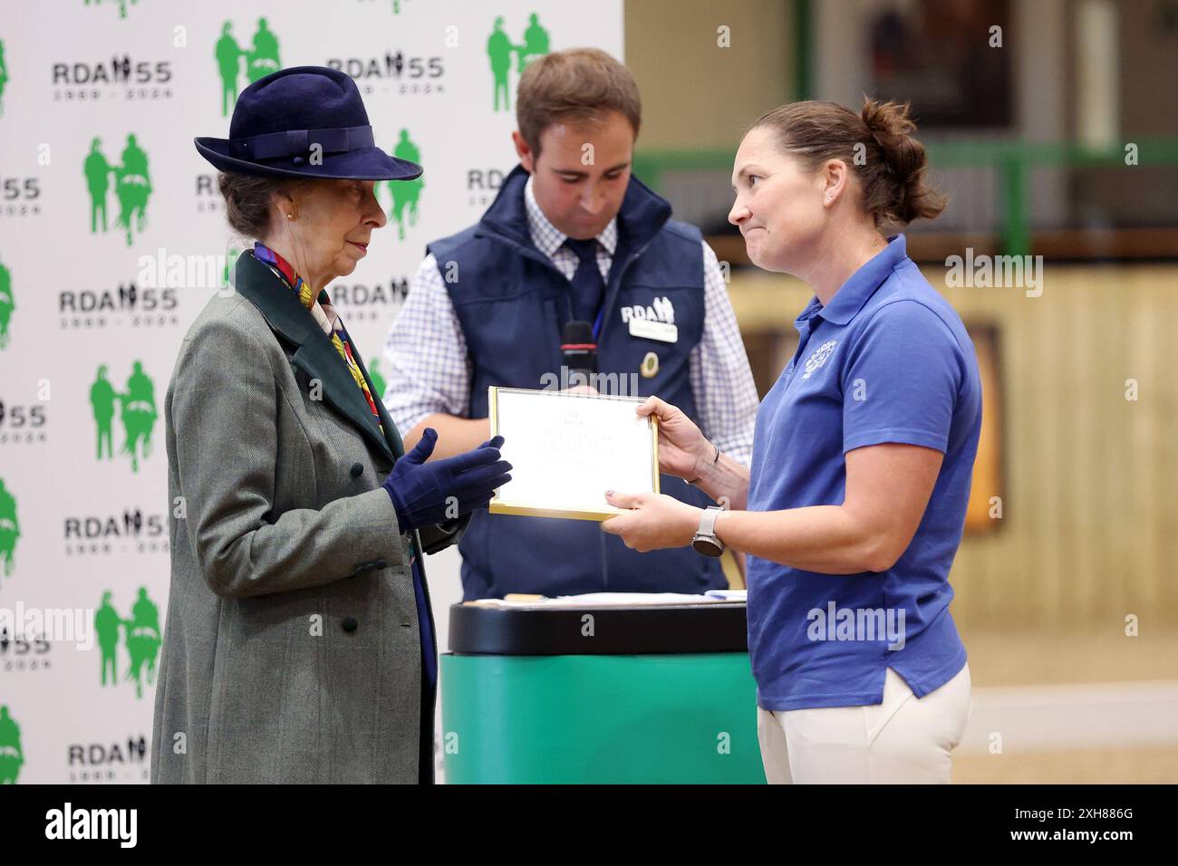 The Princess Royal presents an award during the Riding for the Disabled ...