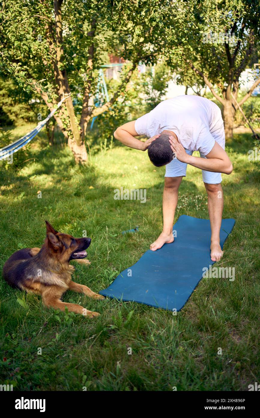 Man somatic exercises dog in hi-res stock photography and images - Alamy