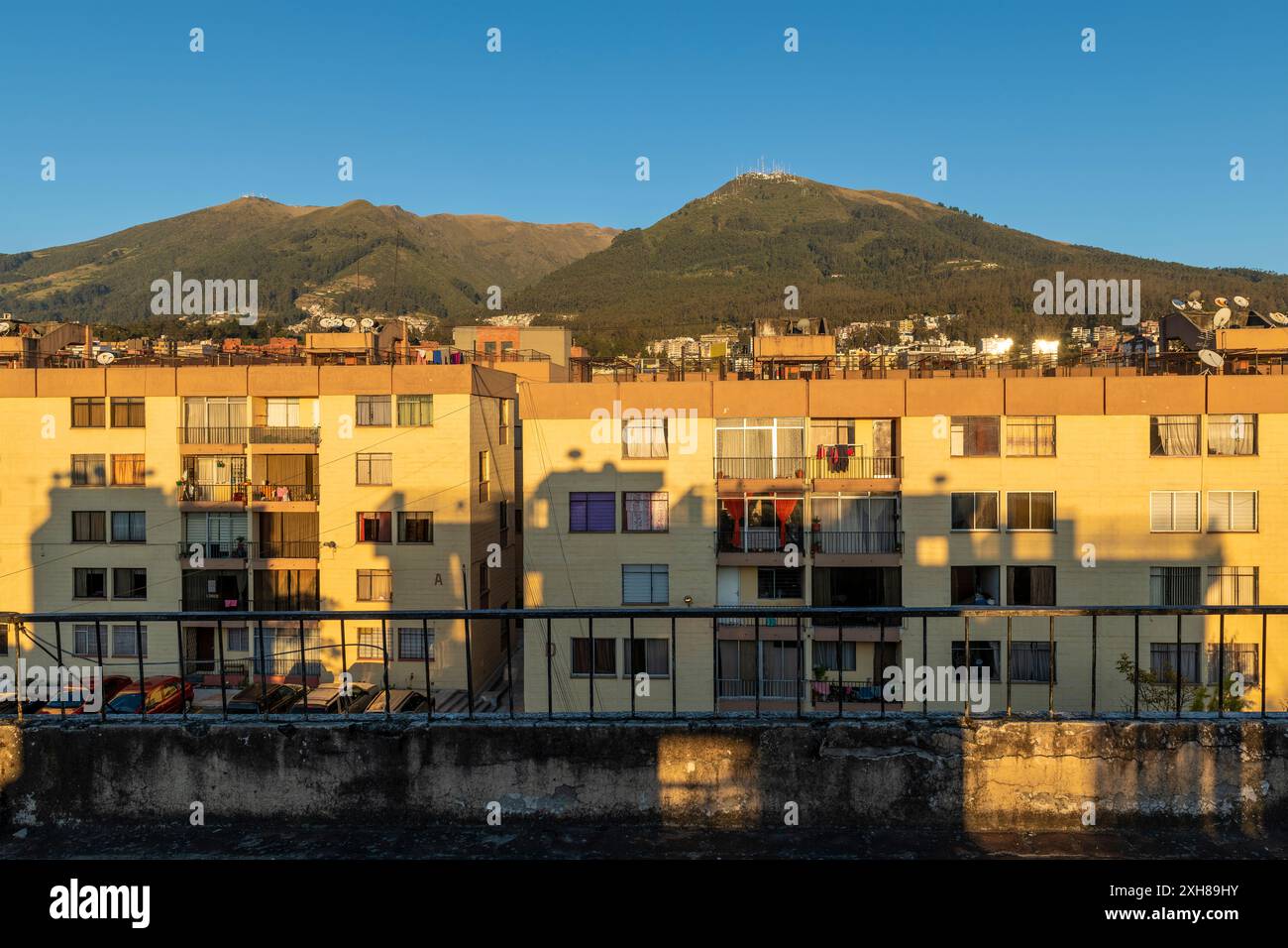 Quito cityscape at sunrise with Pichincha Volcano, Ecuador Stock Photo ...