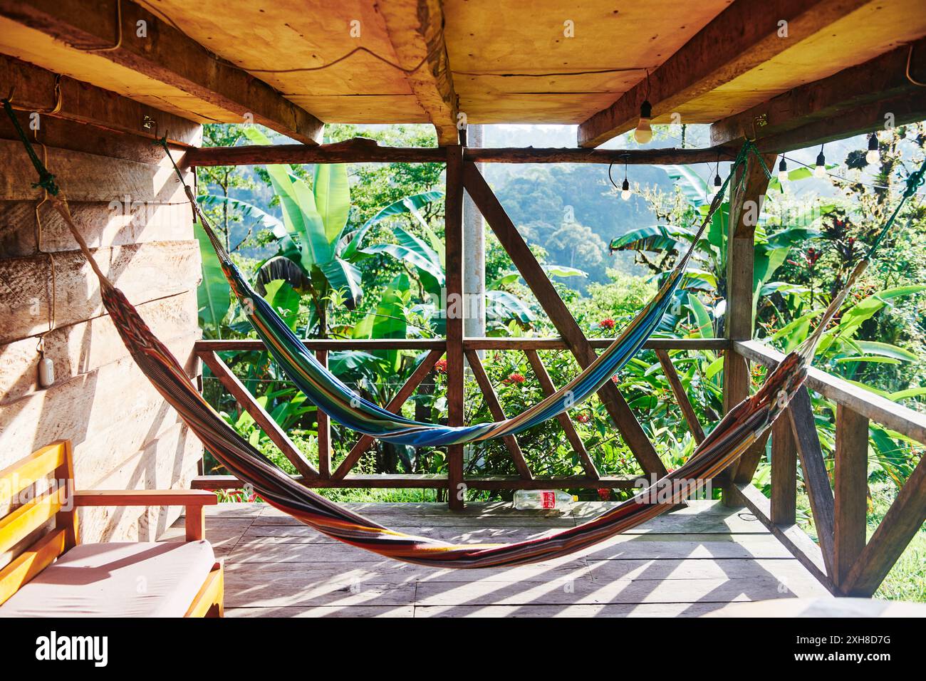 Hammocks on the porch of a bungalow in Maquipucuna Cloudforest, Ecuador ...