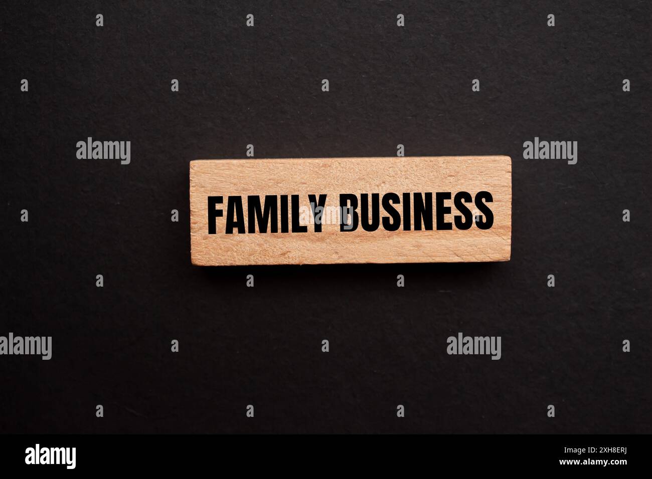 Family business message written on single wooden block with black ...