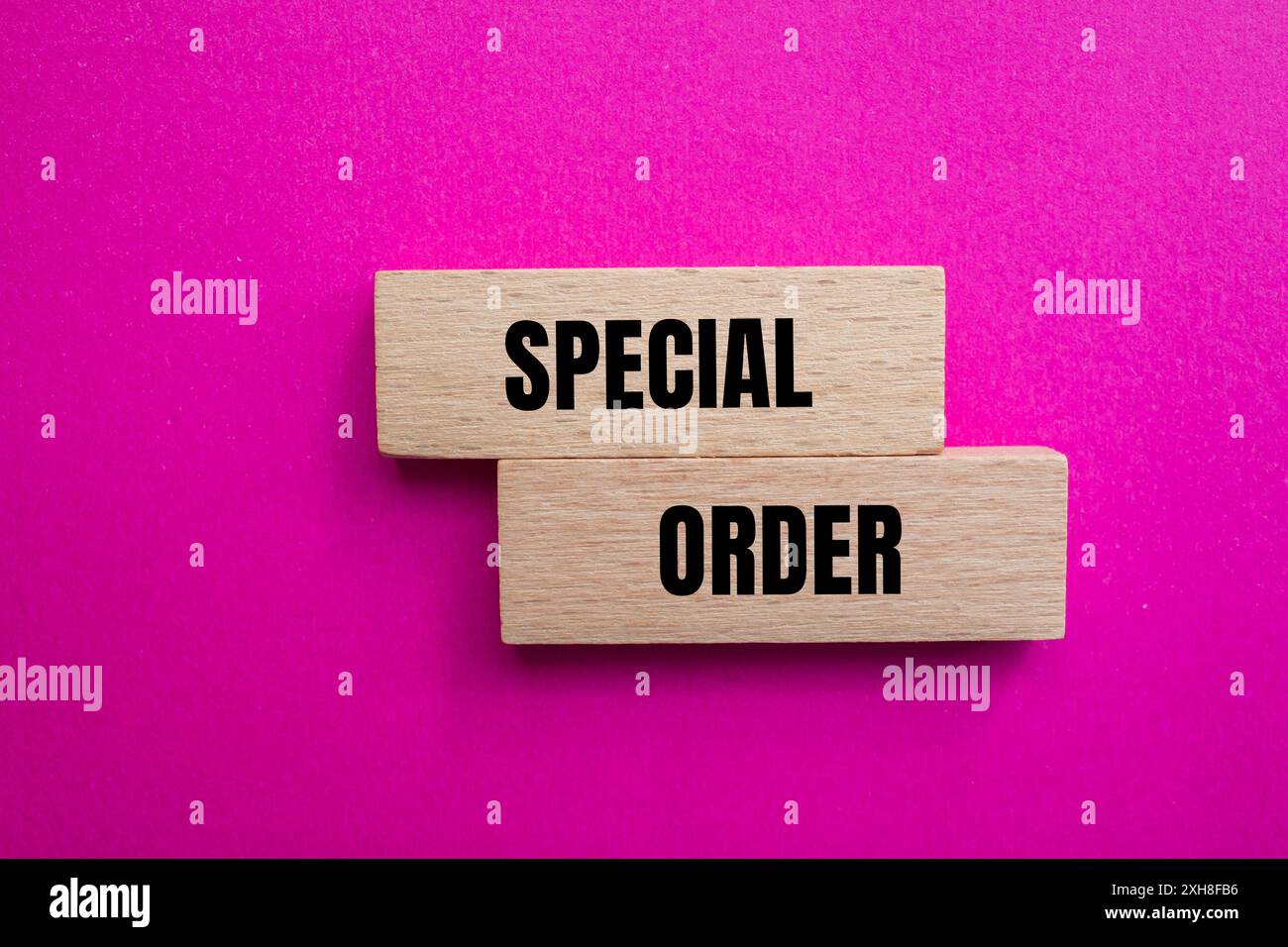 Special order message written on wodoen blocks with pink background ...