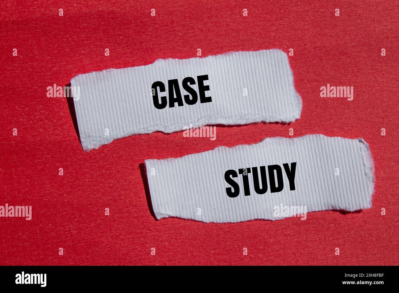 Case study message written on ripped torn white paper with red background. Conceptual case study ...