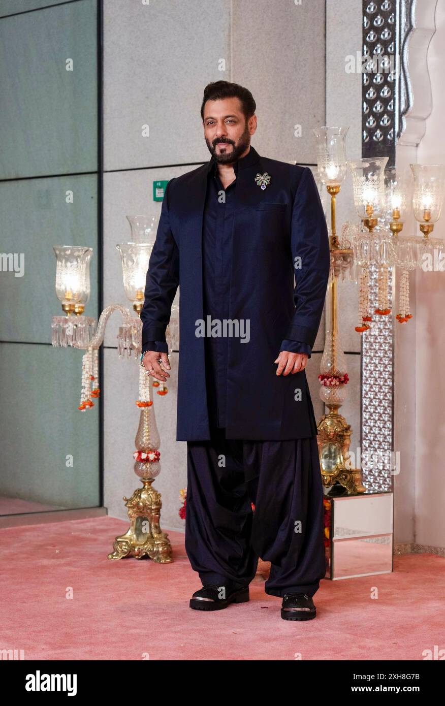 Bollywood actor Salman Khan poses for a photograph at the wedding of ...