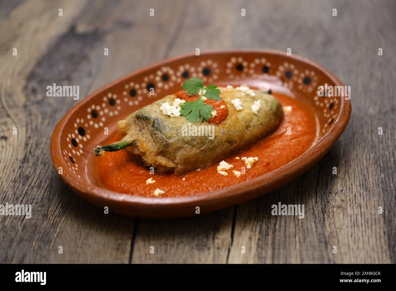 chile relleno (fried poblano pepper stuffed with minced meat and coated ...