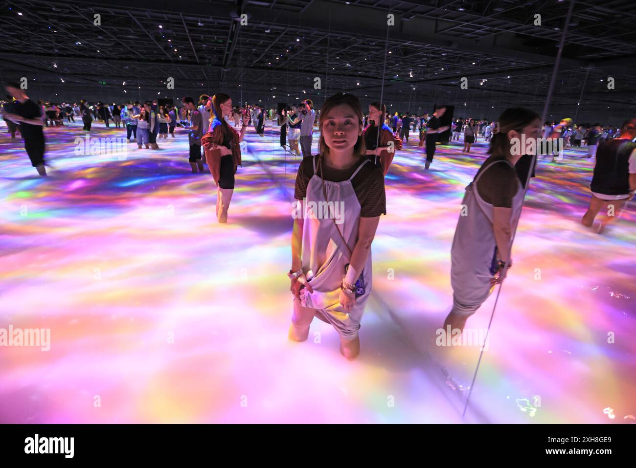 Tokyo - May 4 2023: people experience the light show in teamLab Planets ...