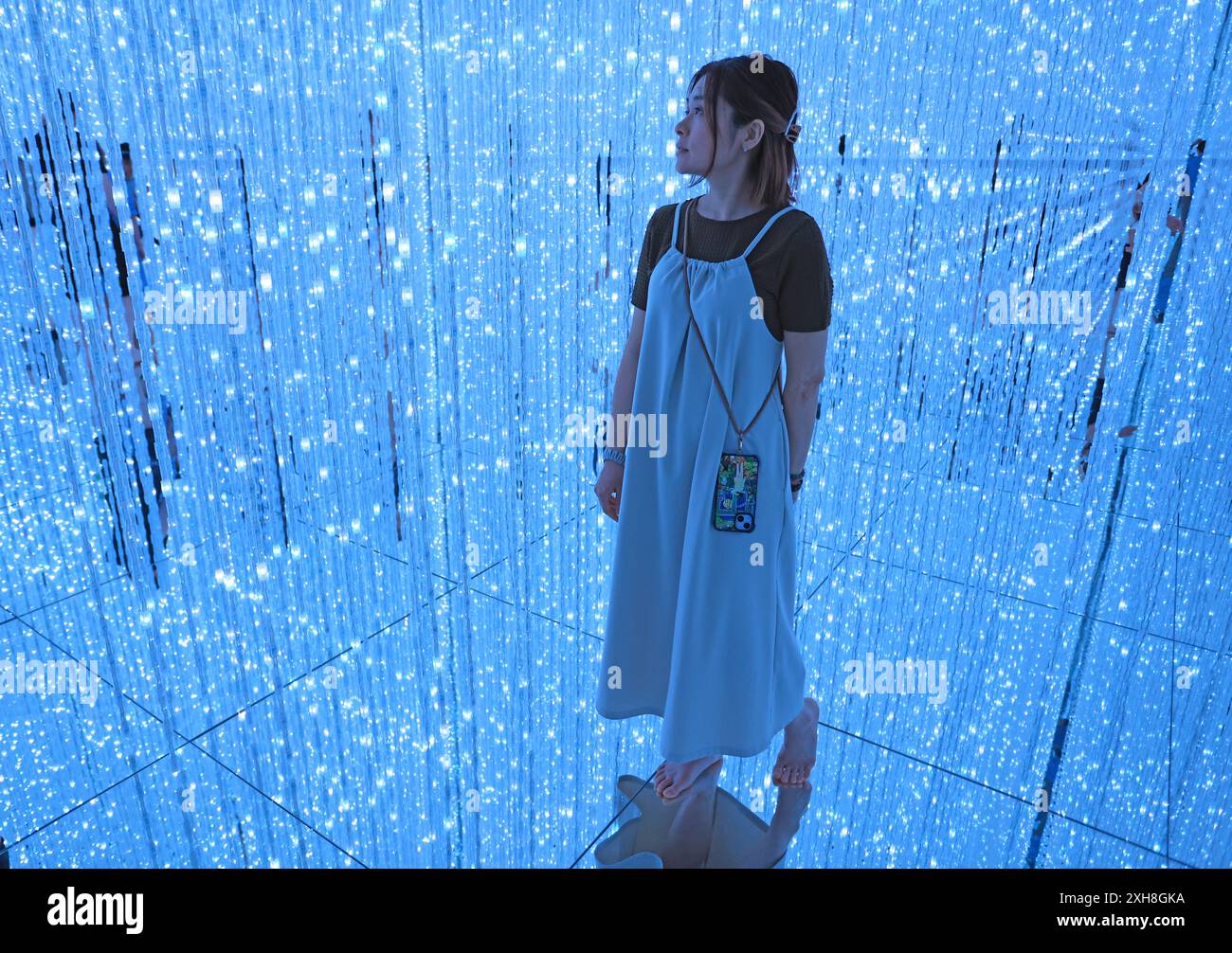 Tokyo - May 4 2023: people experience the light show in teamLab Planets ...