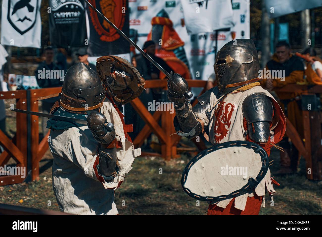 Knights in armor, helmets, with shields and swords Stock Photo - Alamy