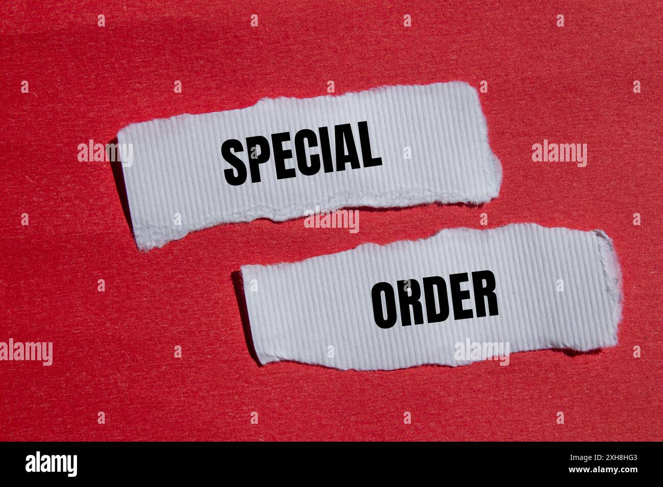 Special order message written on ripped torn white paper with red ...