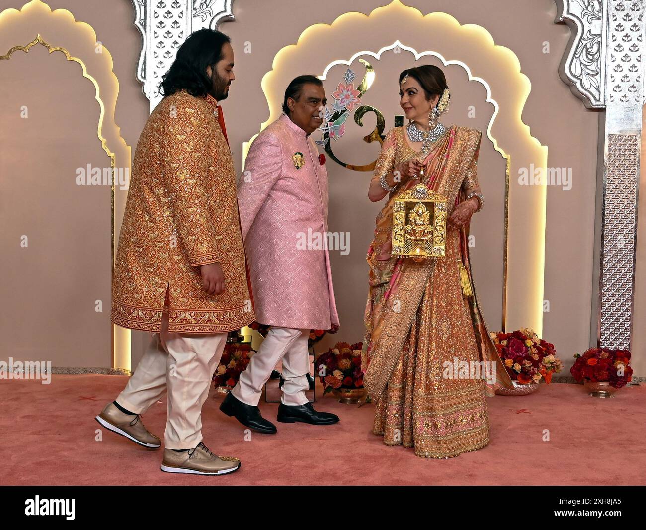 MUMBAI, INDIA - JULY 12: Neeta Ambani, Mukesh Ambani and Anant Ambani ...