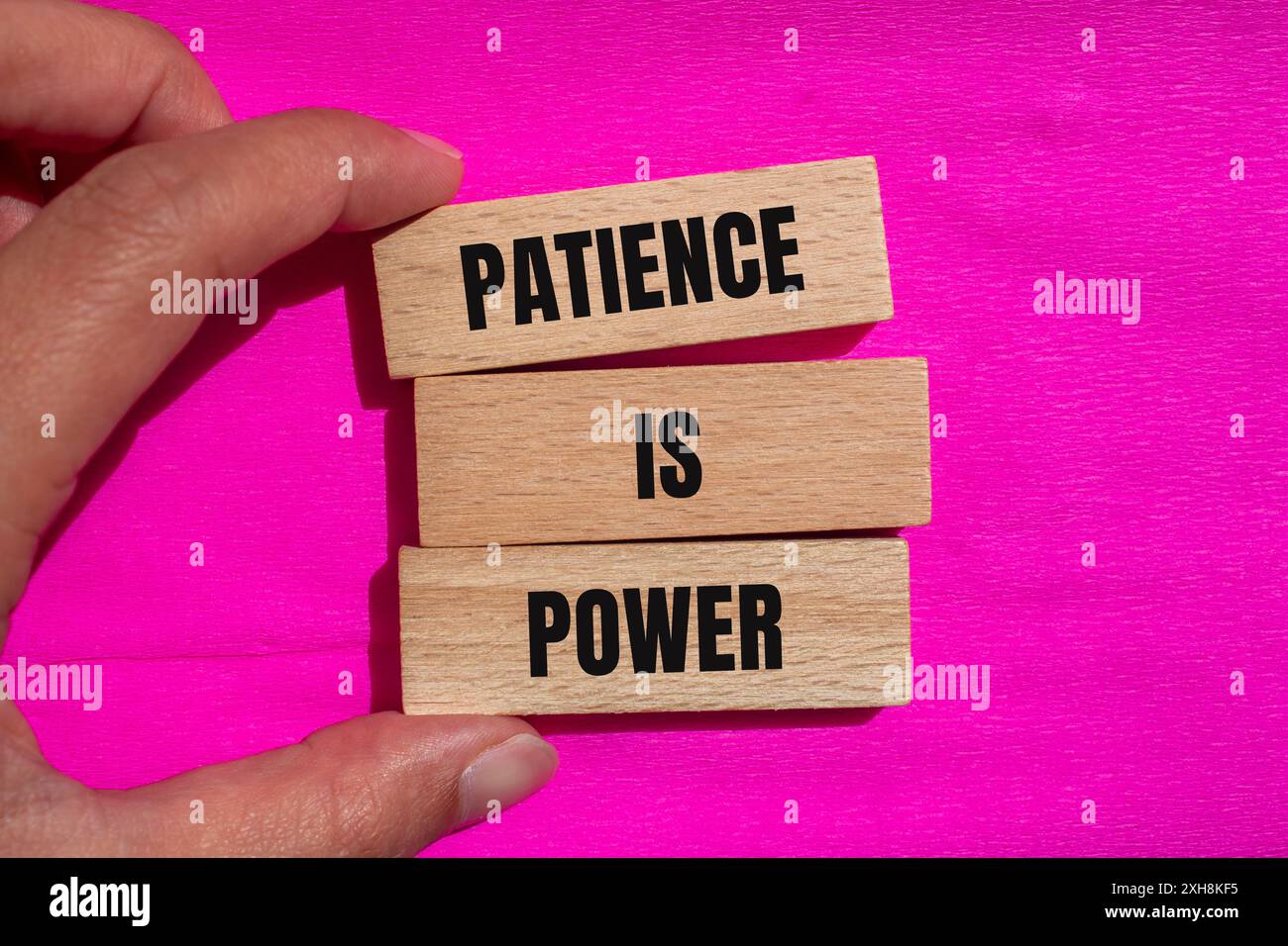 Patience is power words written on wooden blocks with pink background ...