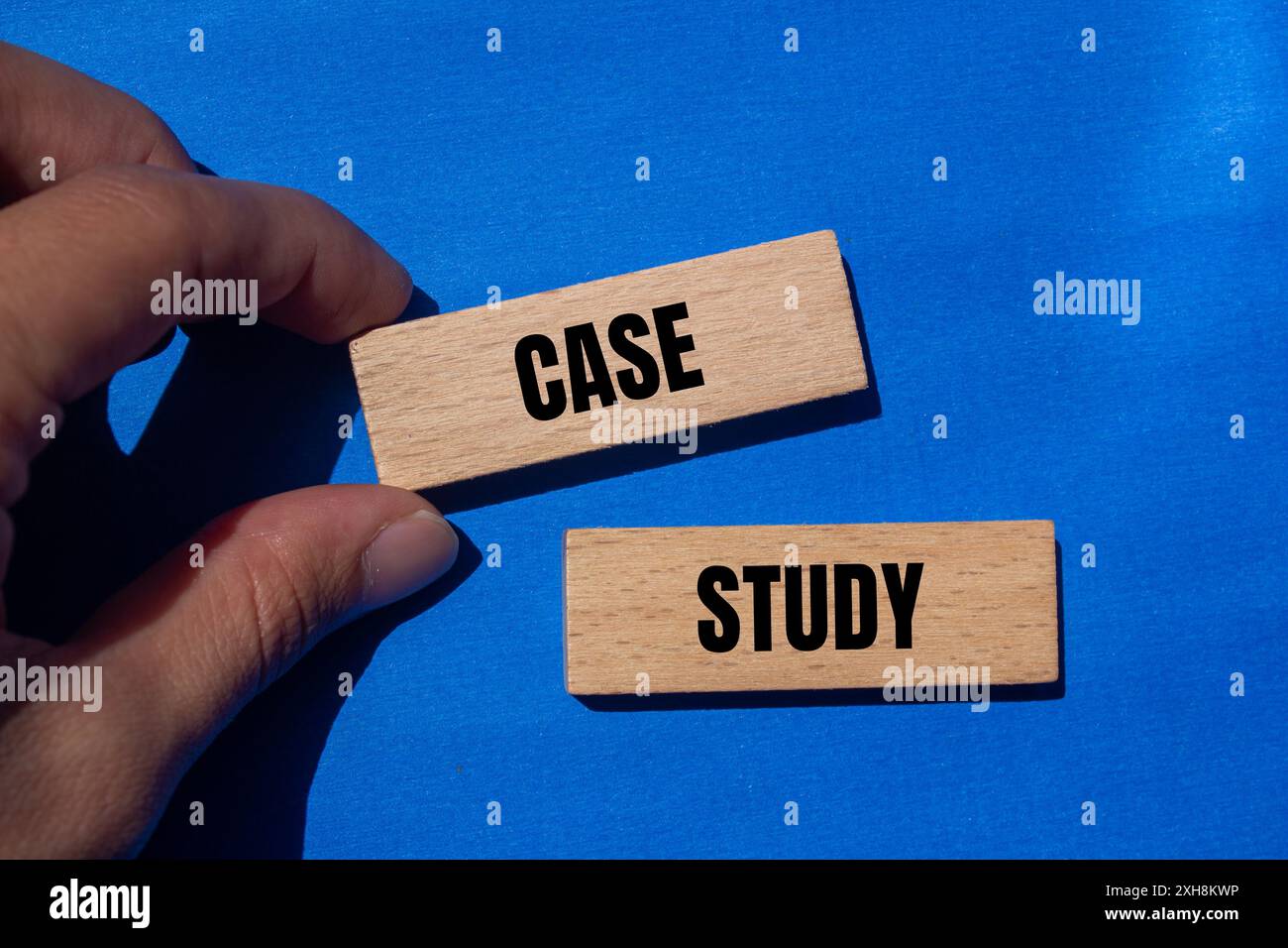 Case study message written on wooden blocks with blue background ...