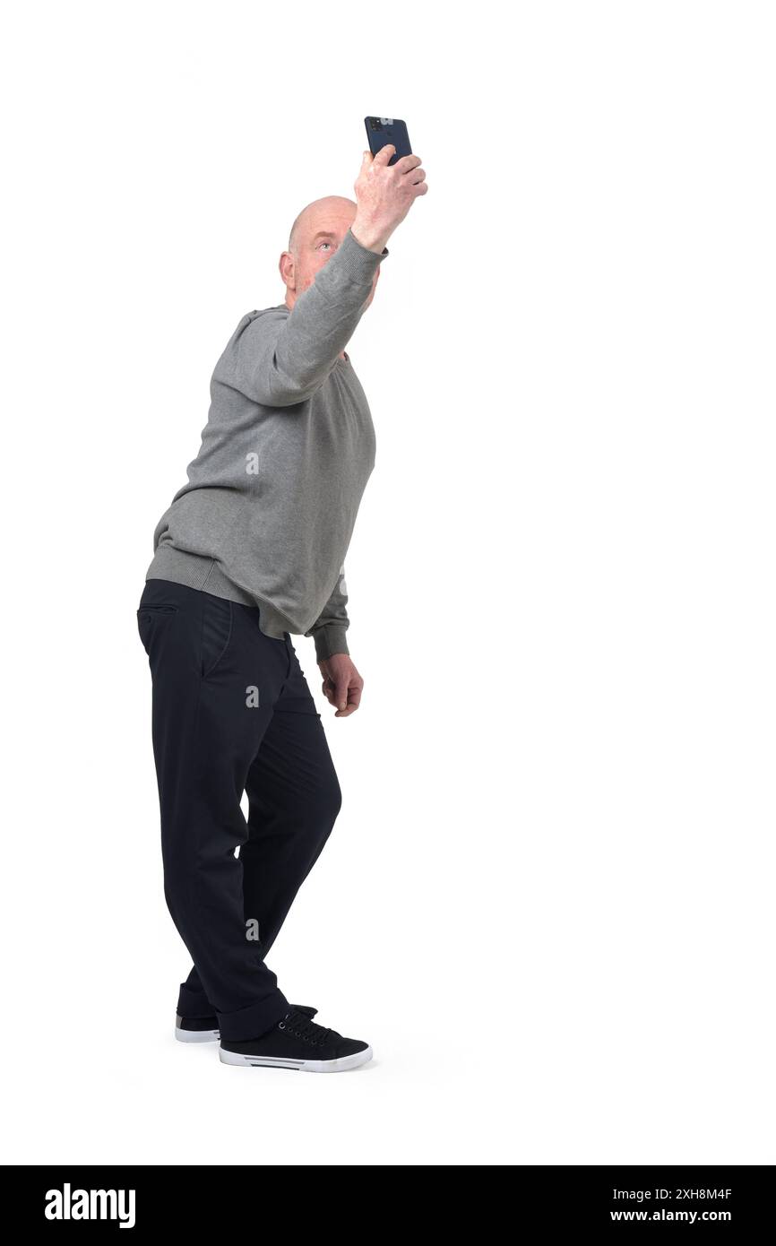 Man taking a picture with a camera Cut Out Stock Images & Pictures - Alamy