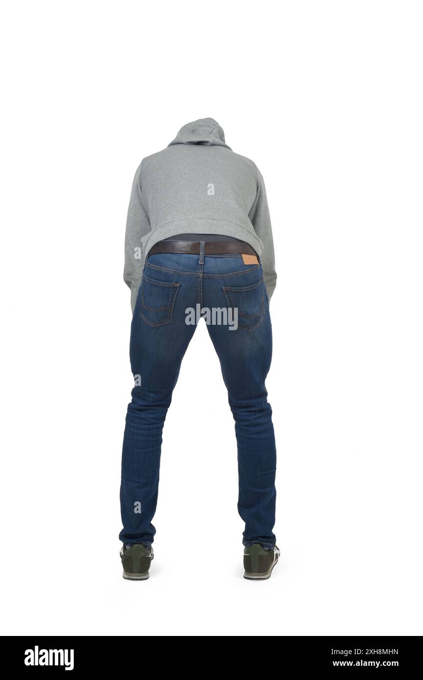 rear view portrait of a crouching man looking down on white background ...