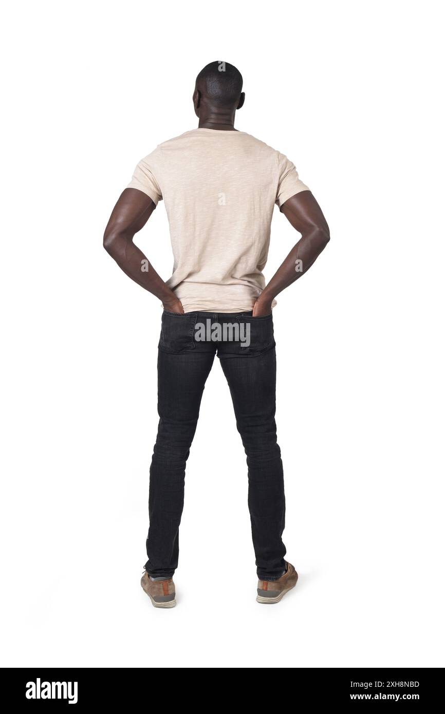 rear view of a man with his hands in his back pockets on white ...