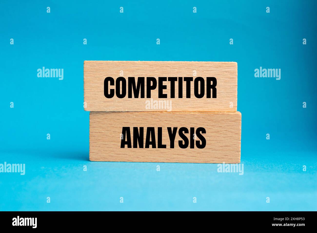 Competitor analysis message written on wooden blocks with blue ...