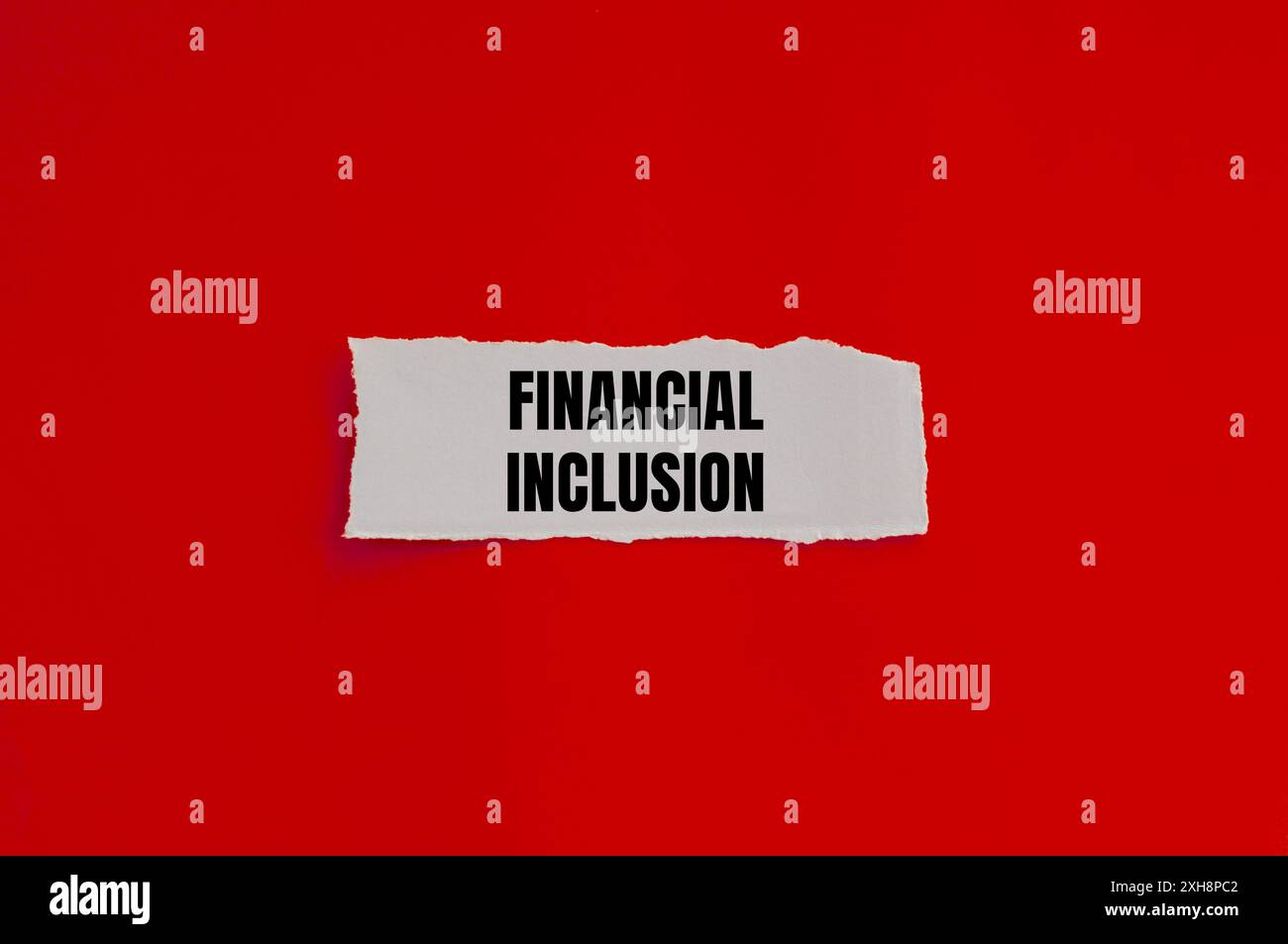 Financial inclusion message written on ripped torn paper piece with red ...