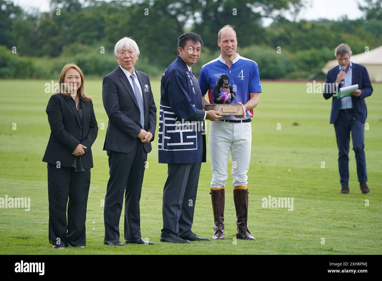 The Prince of Wales is presented with a trophy during the Out-Sourcing ...