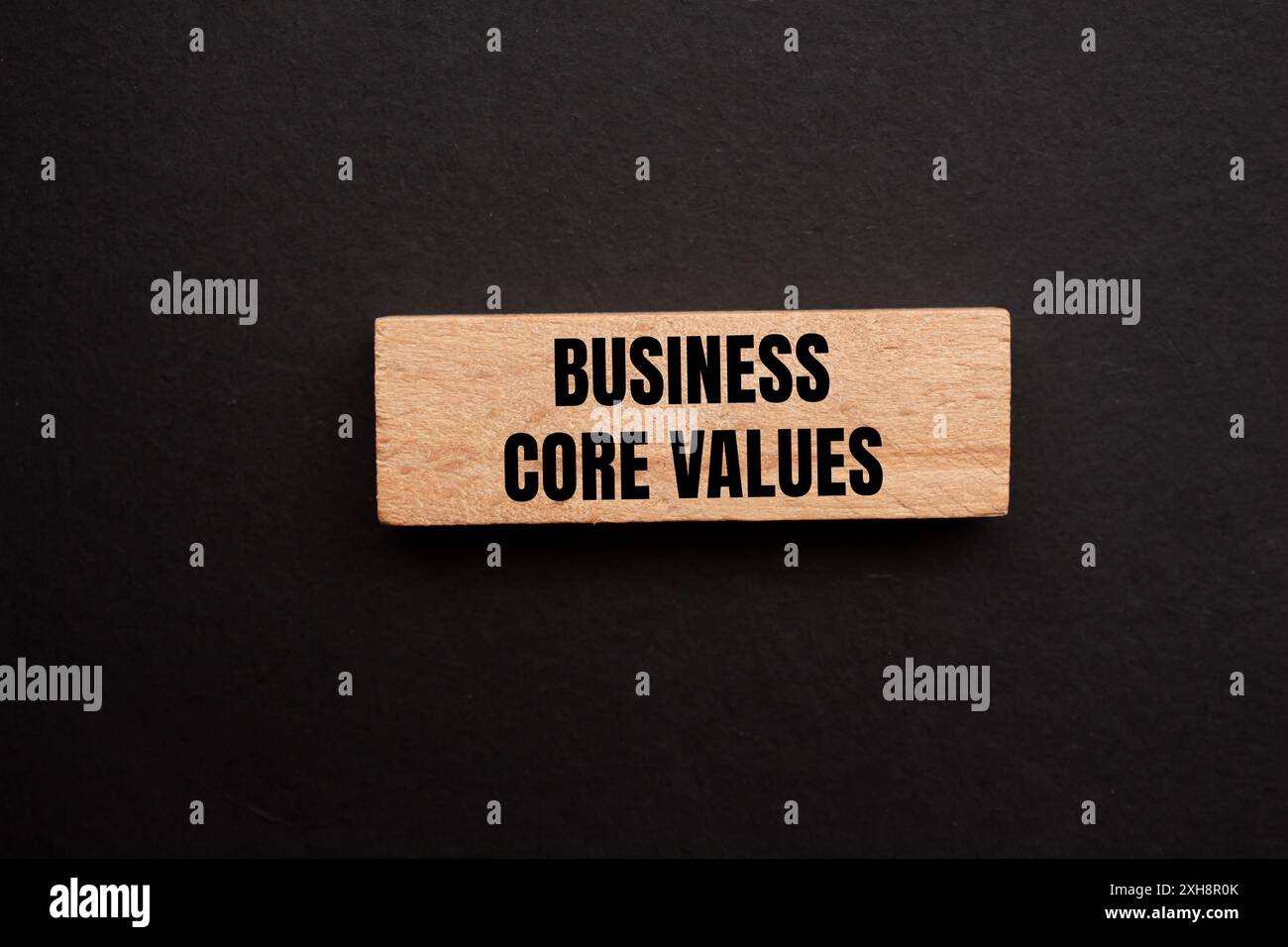 Business core values message written on single wooden block with black ...
