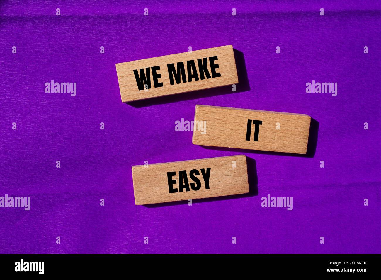 We make it easy message written on wodoen blocks with purple background ...
