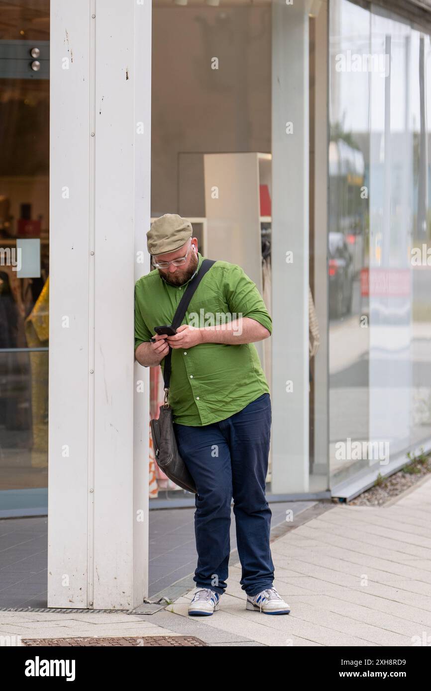11 July 2024. Leith,Edinburgh,Scotland. This is a man using his mobile ...