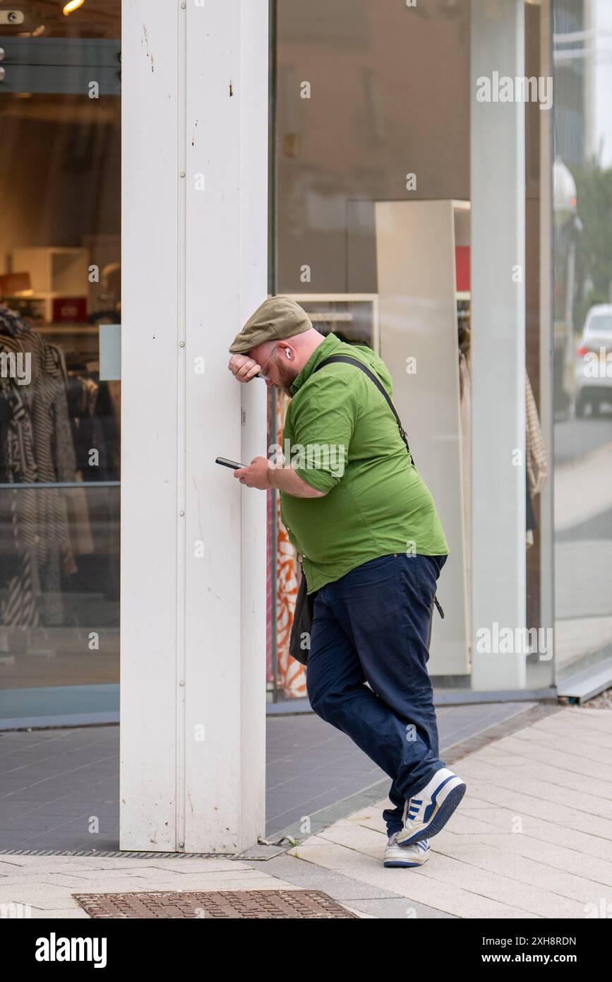 11 July 2024. Leith,Edinburgh,Scotland. This is a man using his mobile ...
