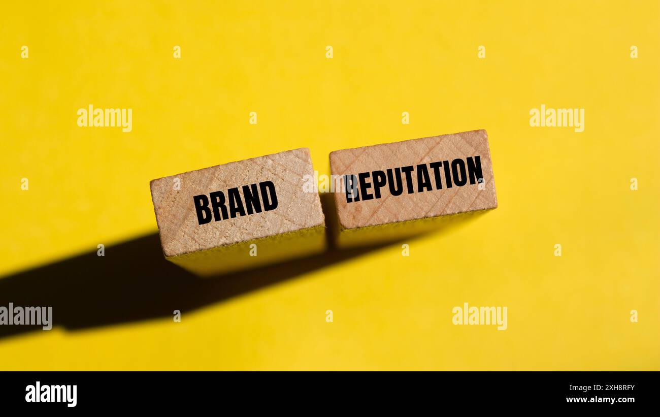 Brand reputation message written on wooden blocks with yellow ...