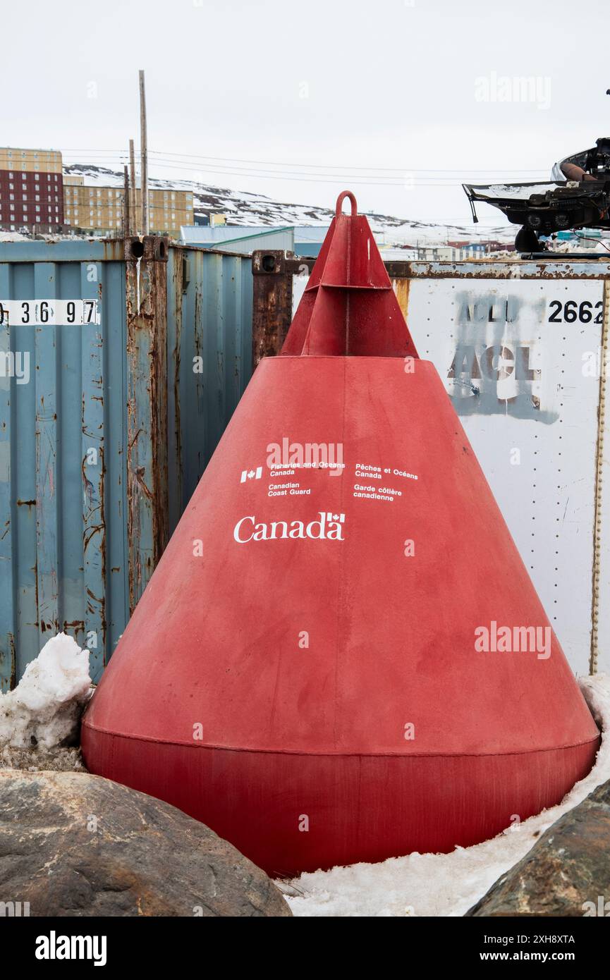 Red starboard marker buoy on the beach on Frobisher Bay in Iqaluit ...