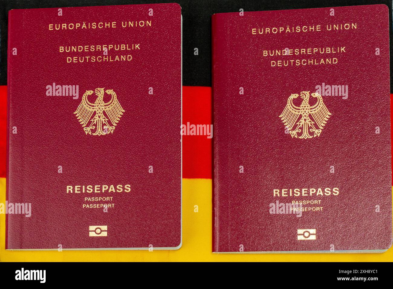 Two Red passports of a German citizen. Passport against the background ...